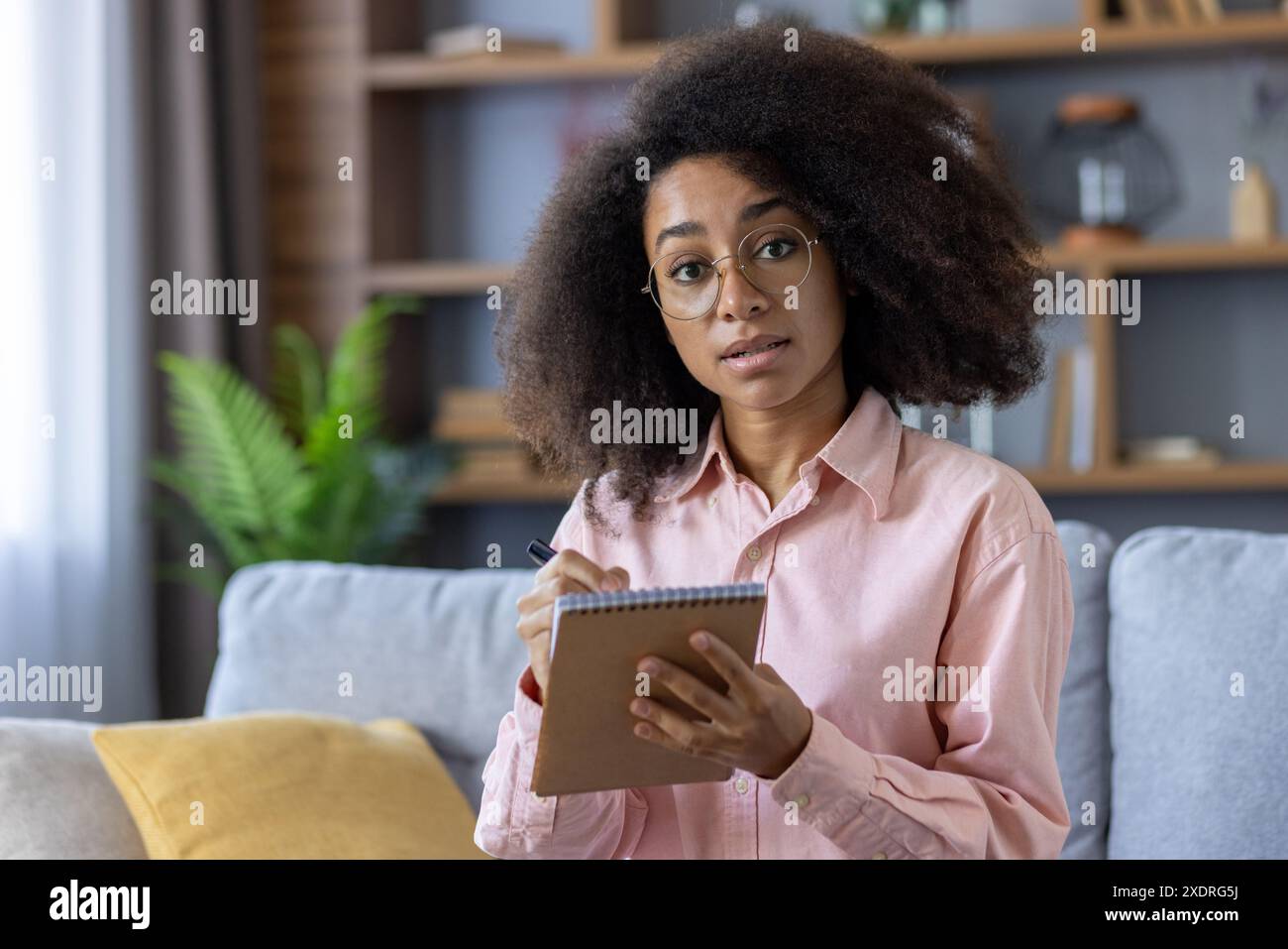 Taking notes during virtual meeting hi-res stock photography and images ...