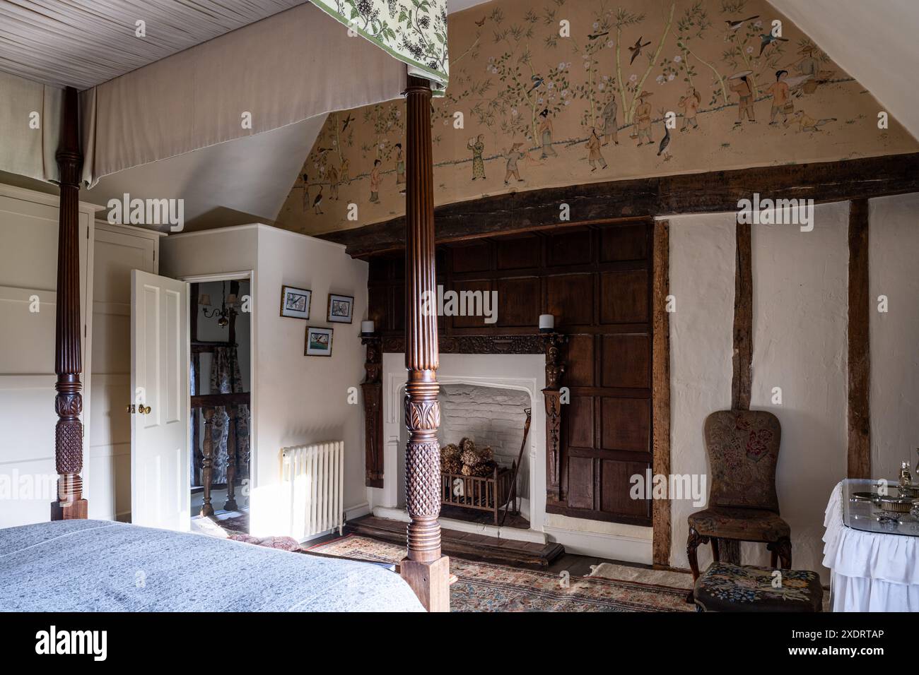 Georgian four poster bed with Oriental detail above panelled fireplace ...