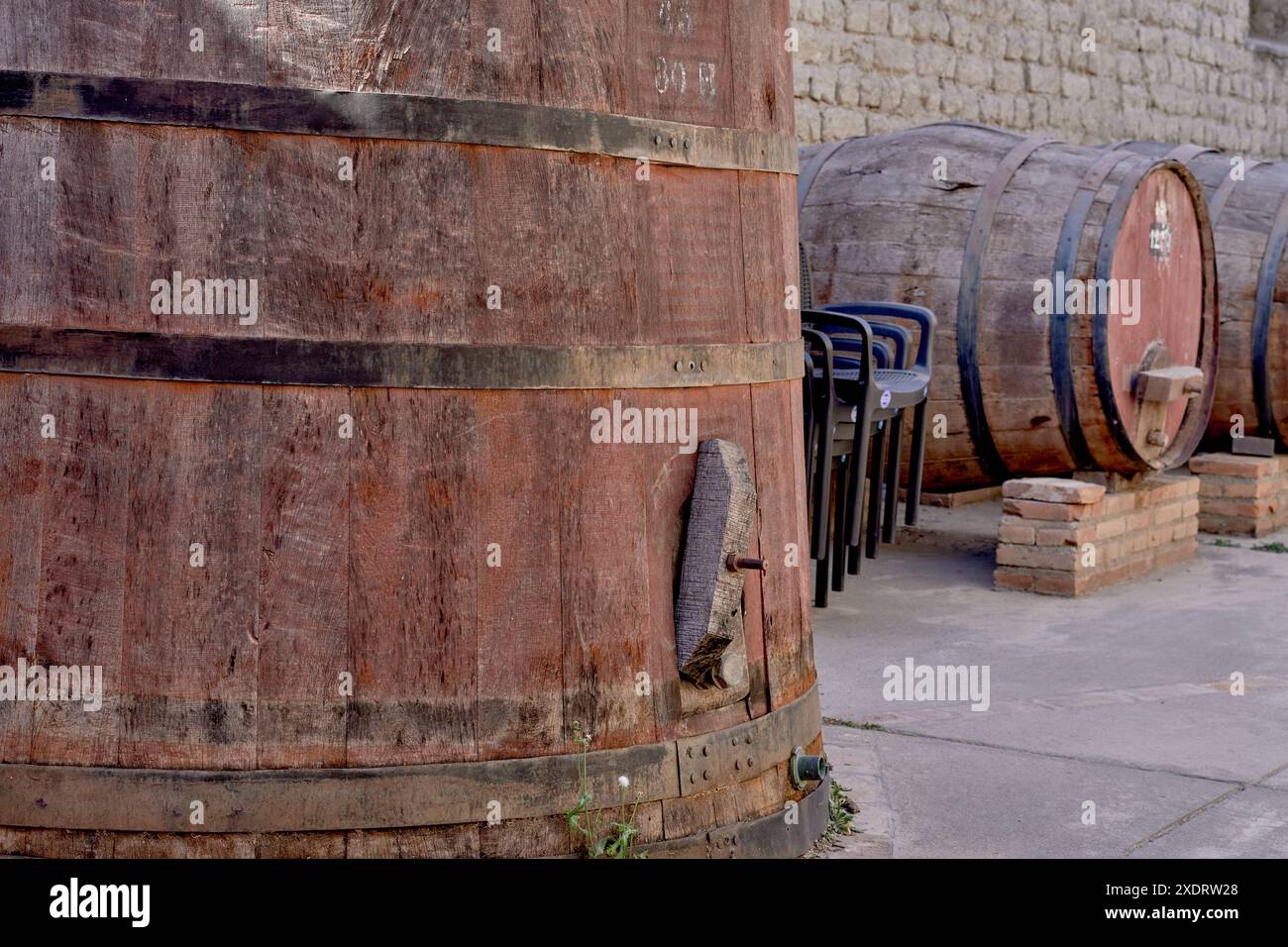 close-up shot of old rustic wooden barrel outside a warehouse Stock ...