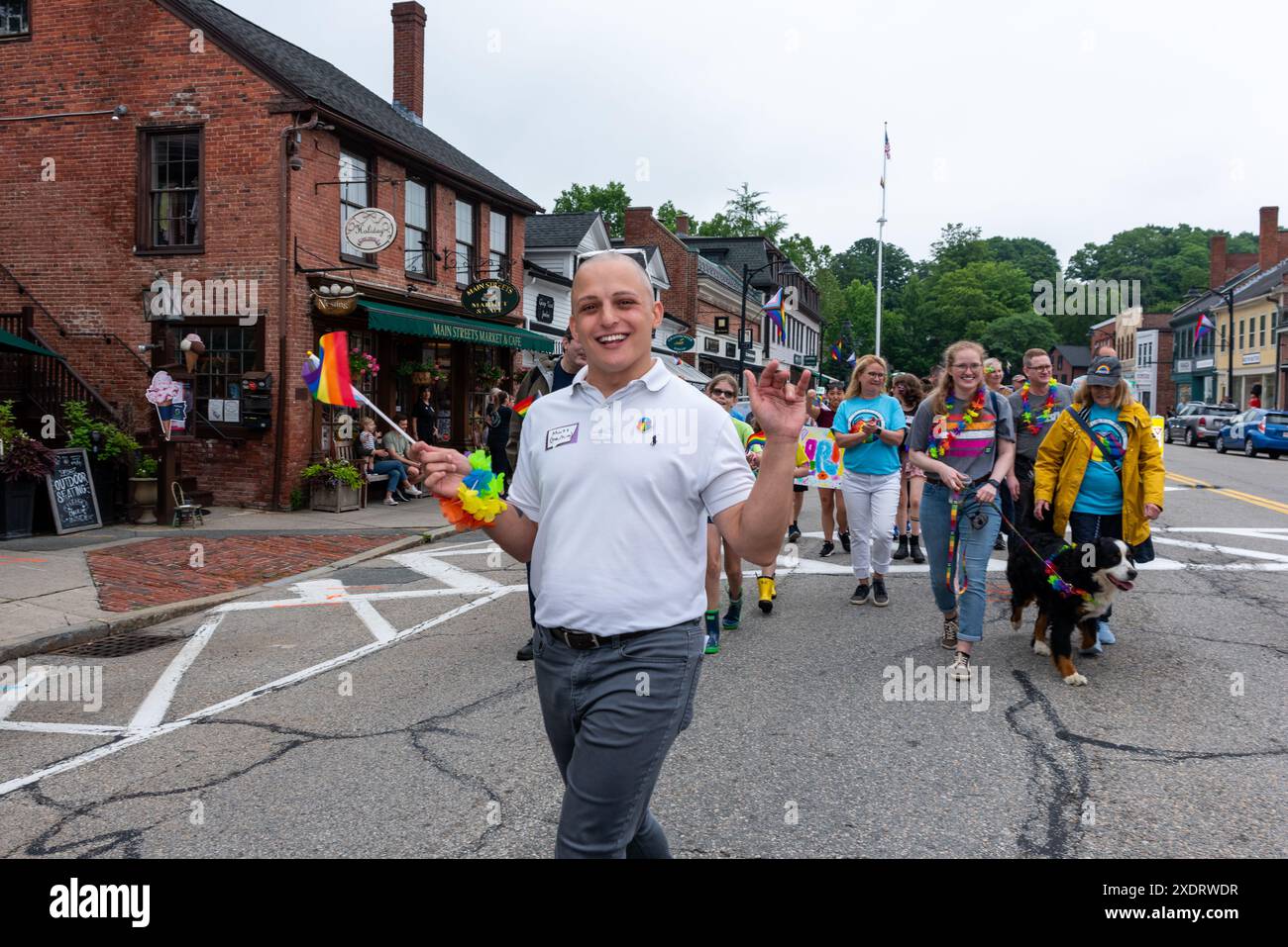 Dr. Matthew Champagne waving in the 2024 Concord Pride Fest parade ...