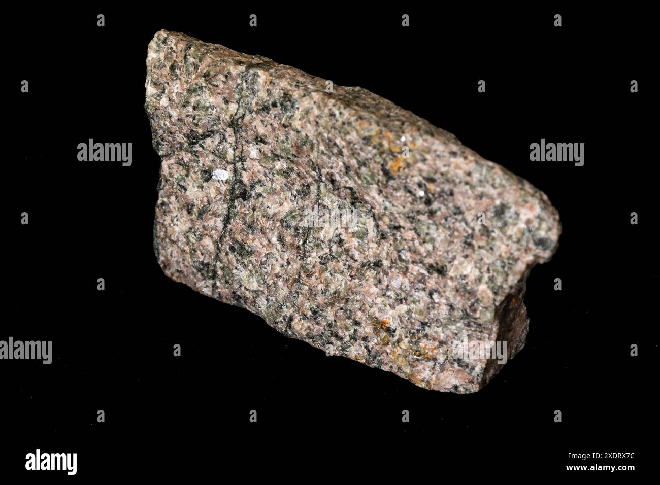 A sample of Archean aged pink and green coloured alkaline granite ...