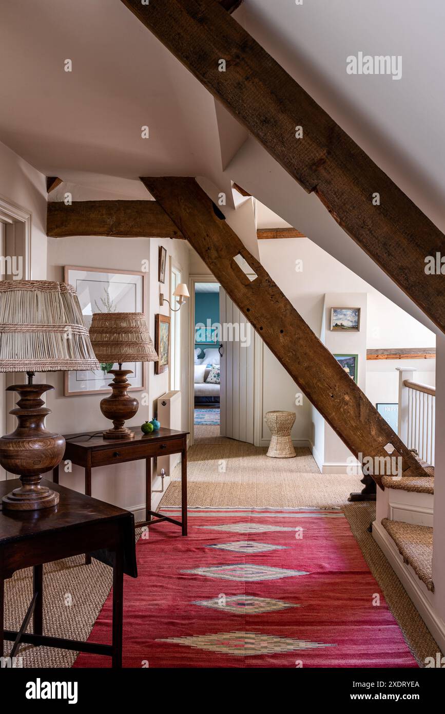 Beamed attic hallway with seagrass atting and Ilala lampshades in ...