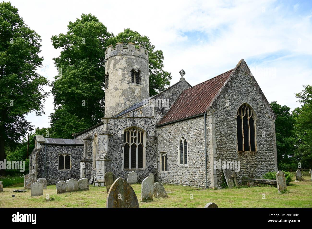 The round towered St Michael's Church, Aslacton, Norfolk, England, UK ...