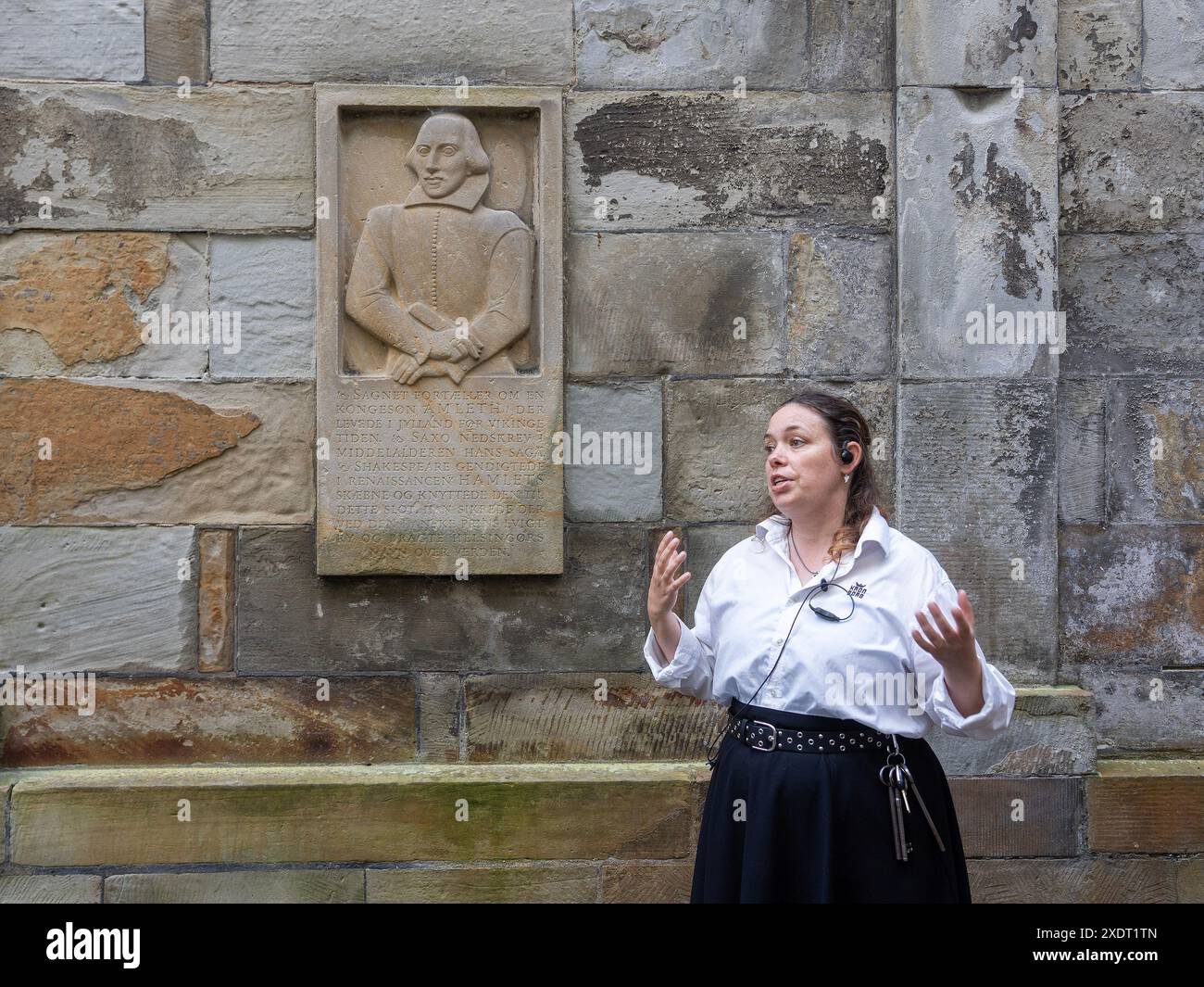 Kronborg Castle tour guide with W. Shakespeare wall plaque in Helsingör ...