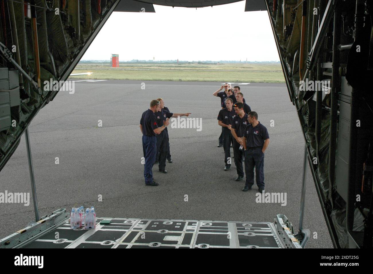 RAF Falcons parachute display team line up behind their C130 Hercules ...