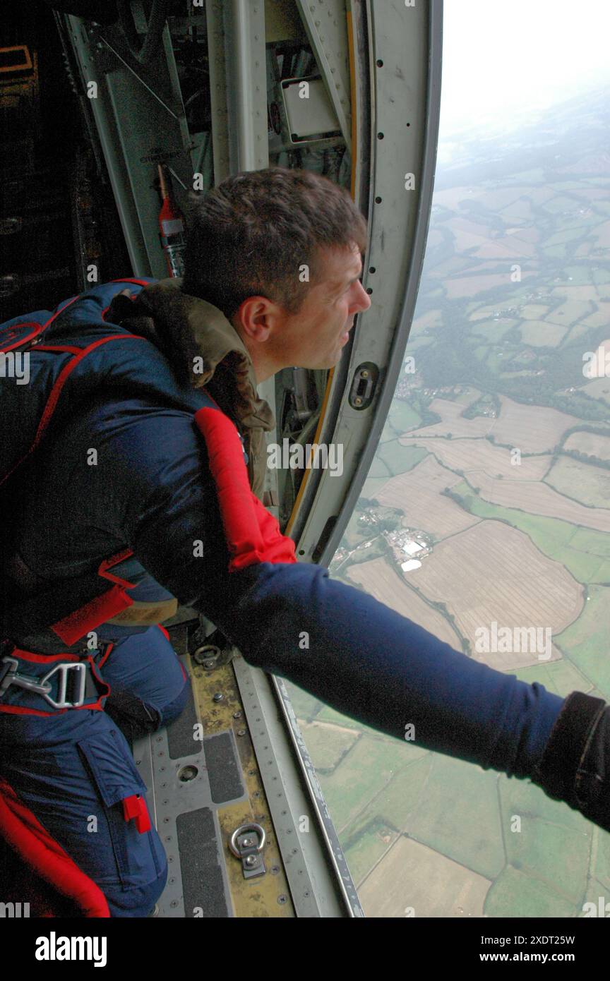 RAF Falcons parachute display team member looks out of C130 Hercules ...