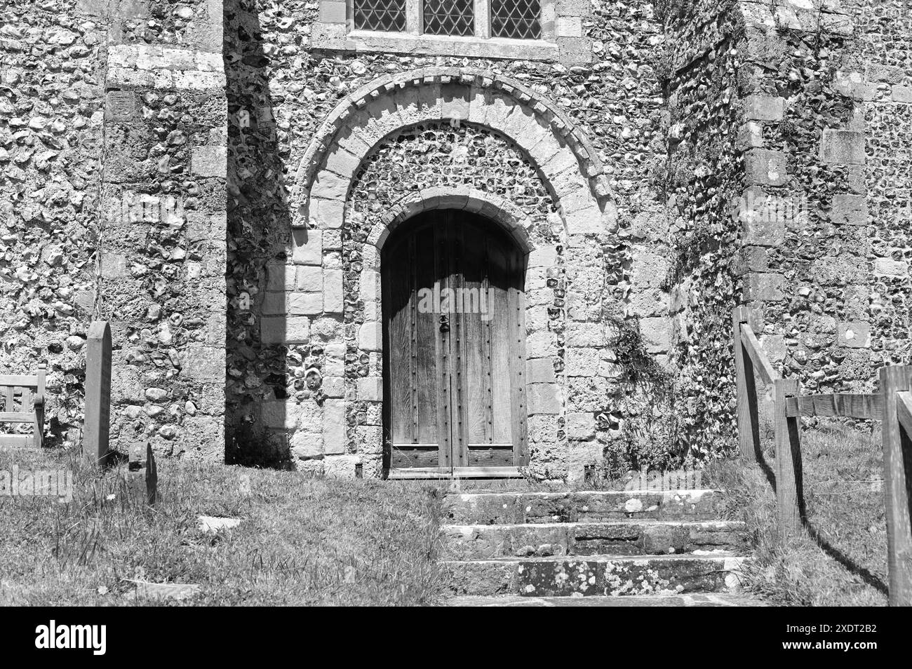 Closed double doors of a Norman church in the UK Stock Photo - Alamy