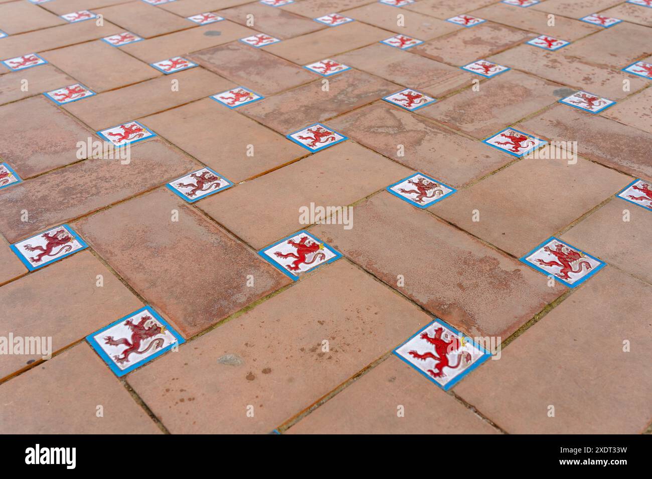 Seville, Spain. February 5, 2024 - Red lion tile pattern on plaza de ...