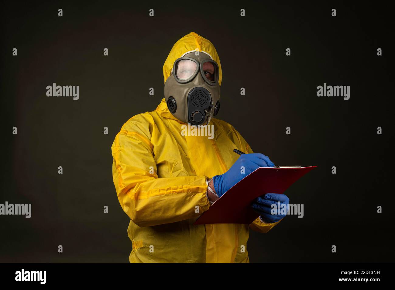 man in a protective suit with a gas mask during a disaster drill Stock ...