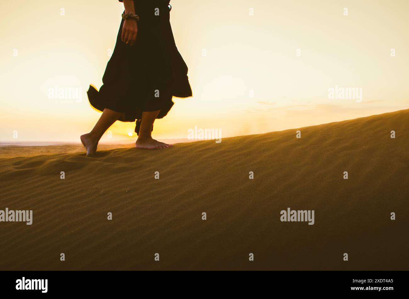 Low angle view iranian woman in long black dress feet walk on KAshan ...