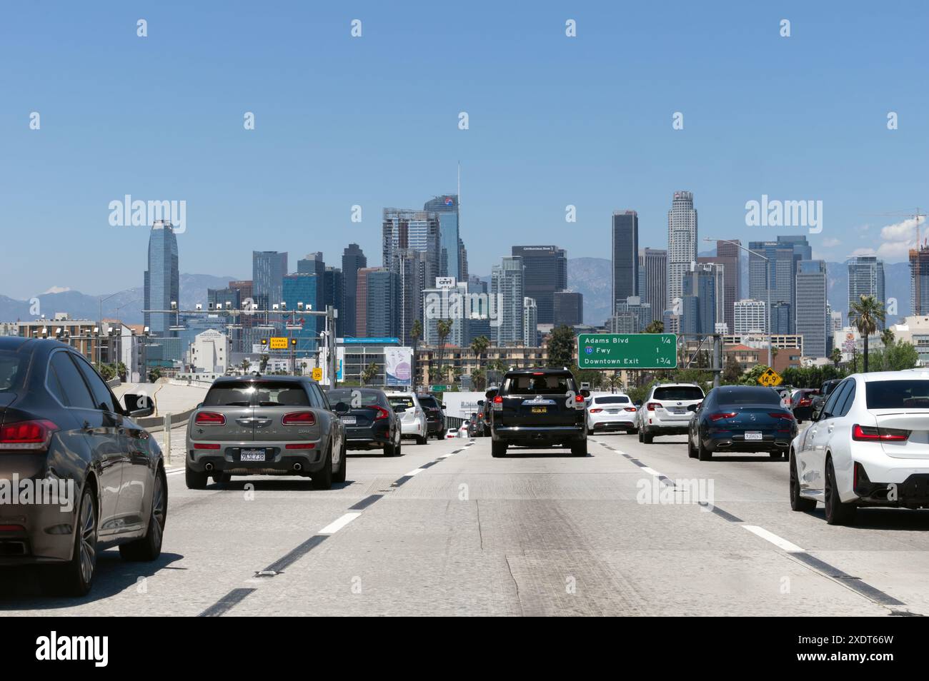 Driving north on freeway 110, showing downtown Los Angeles, California ...