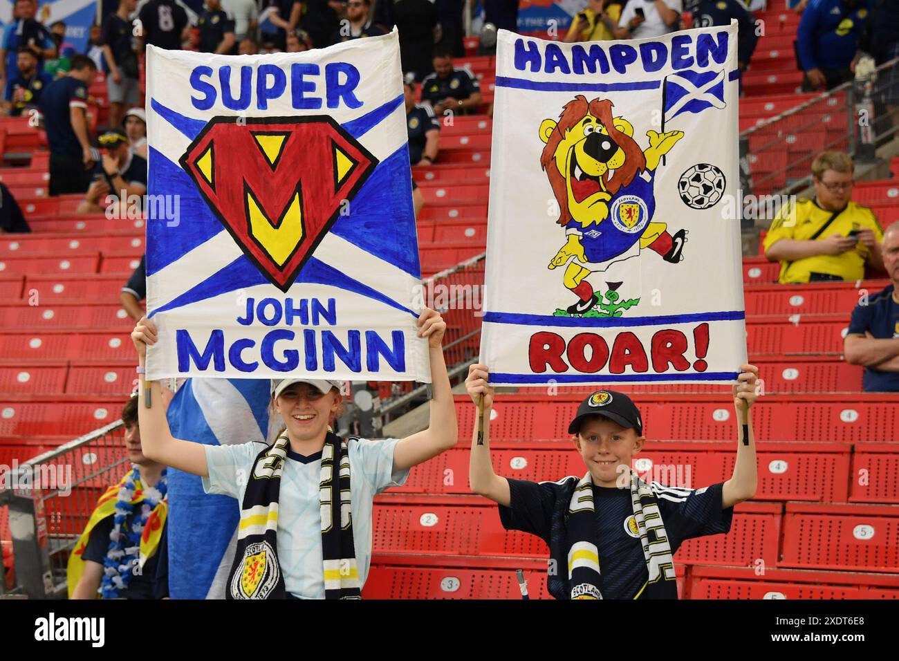 Stuttgart, Germany, 23rd Jun, 2024. Two young Scotland fans show off ...