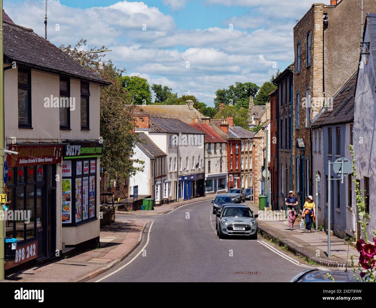 Marlborough Street with high street shops, parking and pedestrians in ...