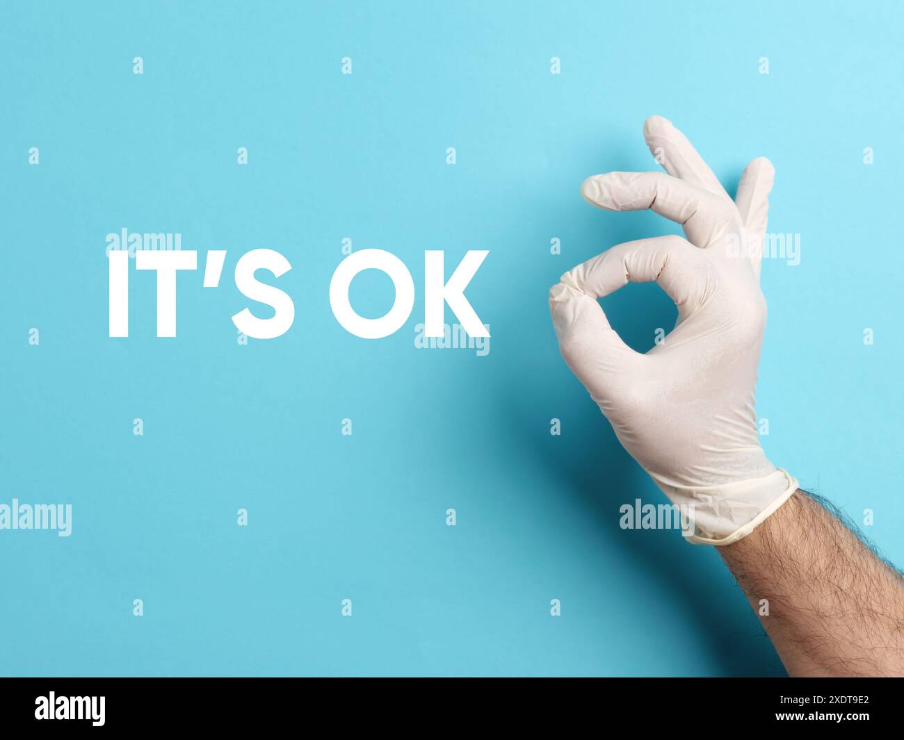 Male hand wearing white medical surgical glove making ok sign gesture ...