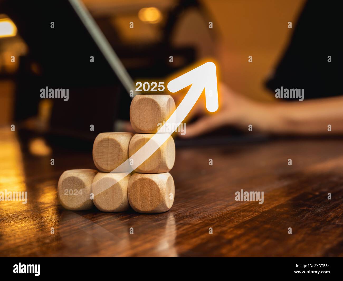 Rise up arrow from 2024 to 2025 year numbers on wooden cube blocks ...