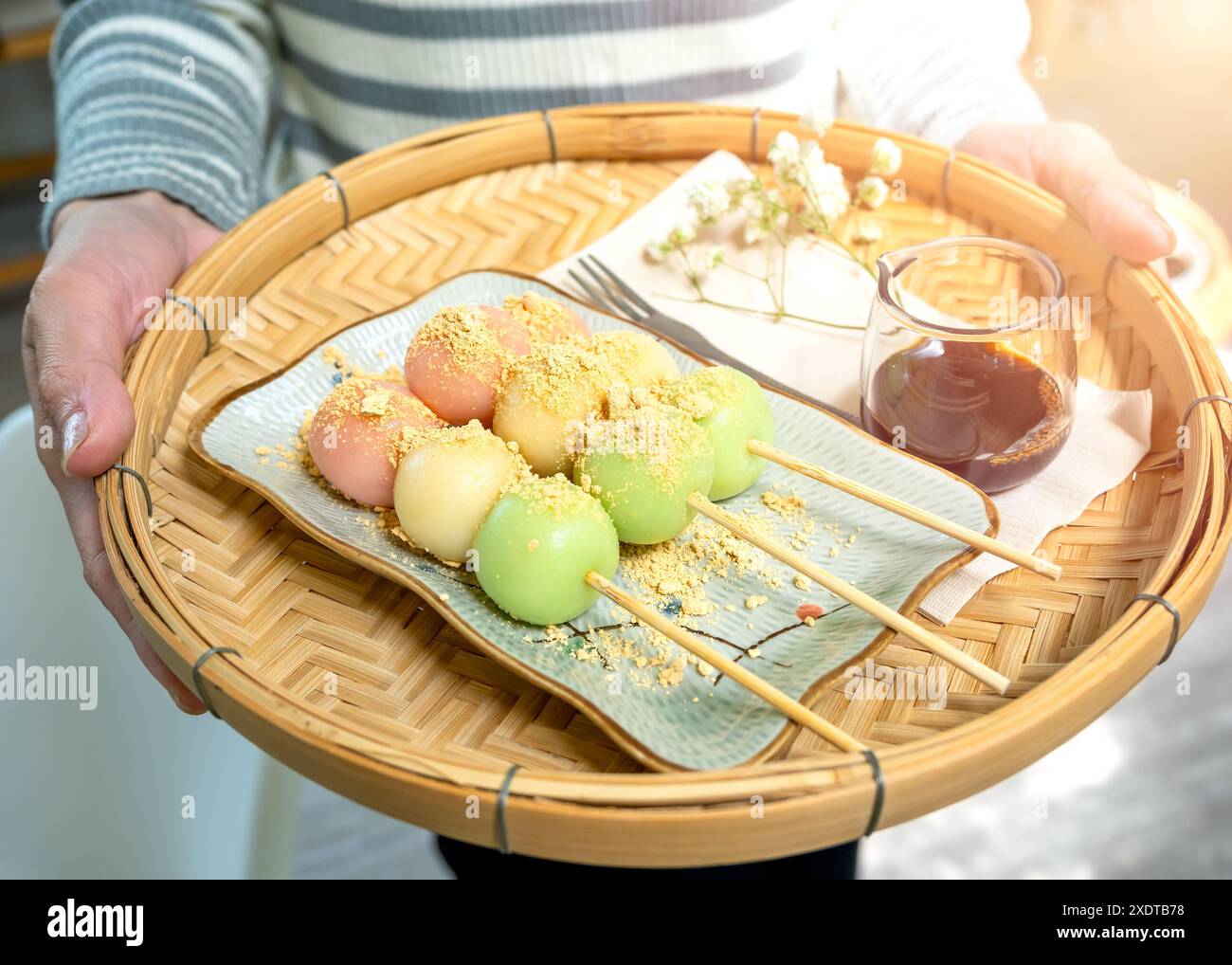 Japanese three colors of Dango in porcelain plate serving in the woven ...