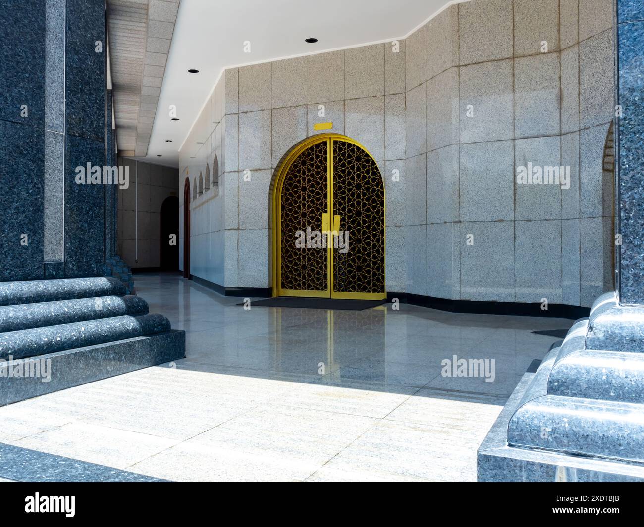 Beautiful pattern on curved wooden door with gold handle, decoration of ...