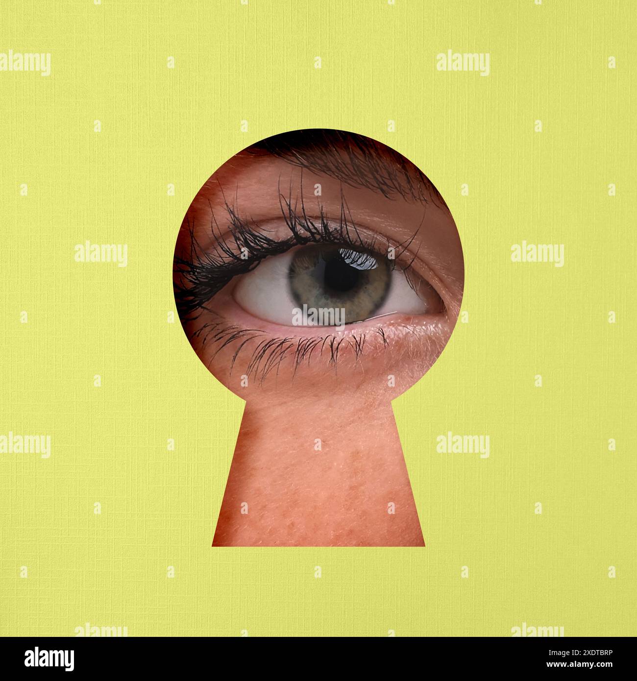 Woman looking through keyhole in color surface Stock Photo - Alamy