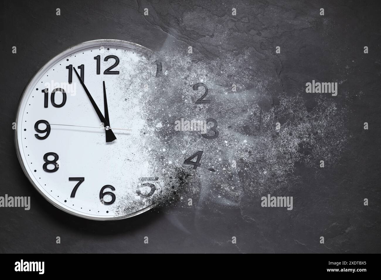 Analog clock dissolving on dark background. Fleeting time Stock Photo ...