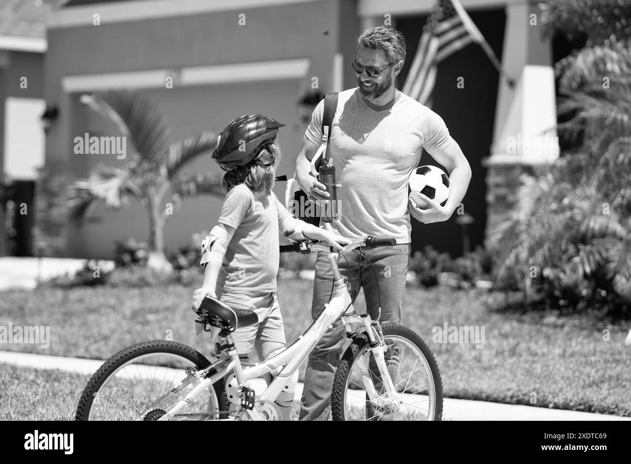 Father and son sharing biking adventure. father and son navigate the ...