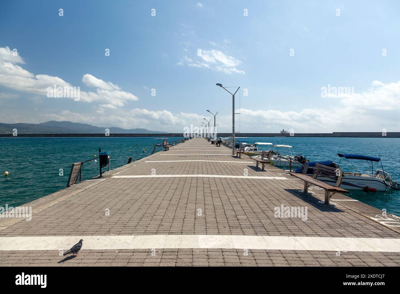 A tranquil pier at the port of Kalamata in southern Greece, offering a ...