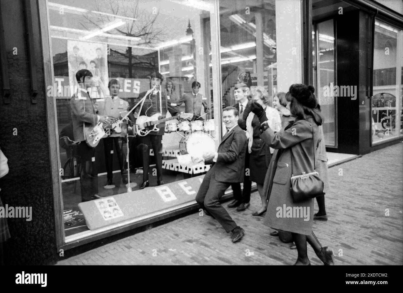 Beatlemania - Beatles fans - 1960s fashion - Beatles in the window of ...