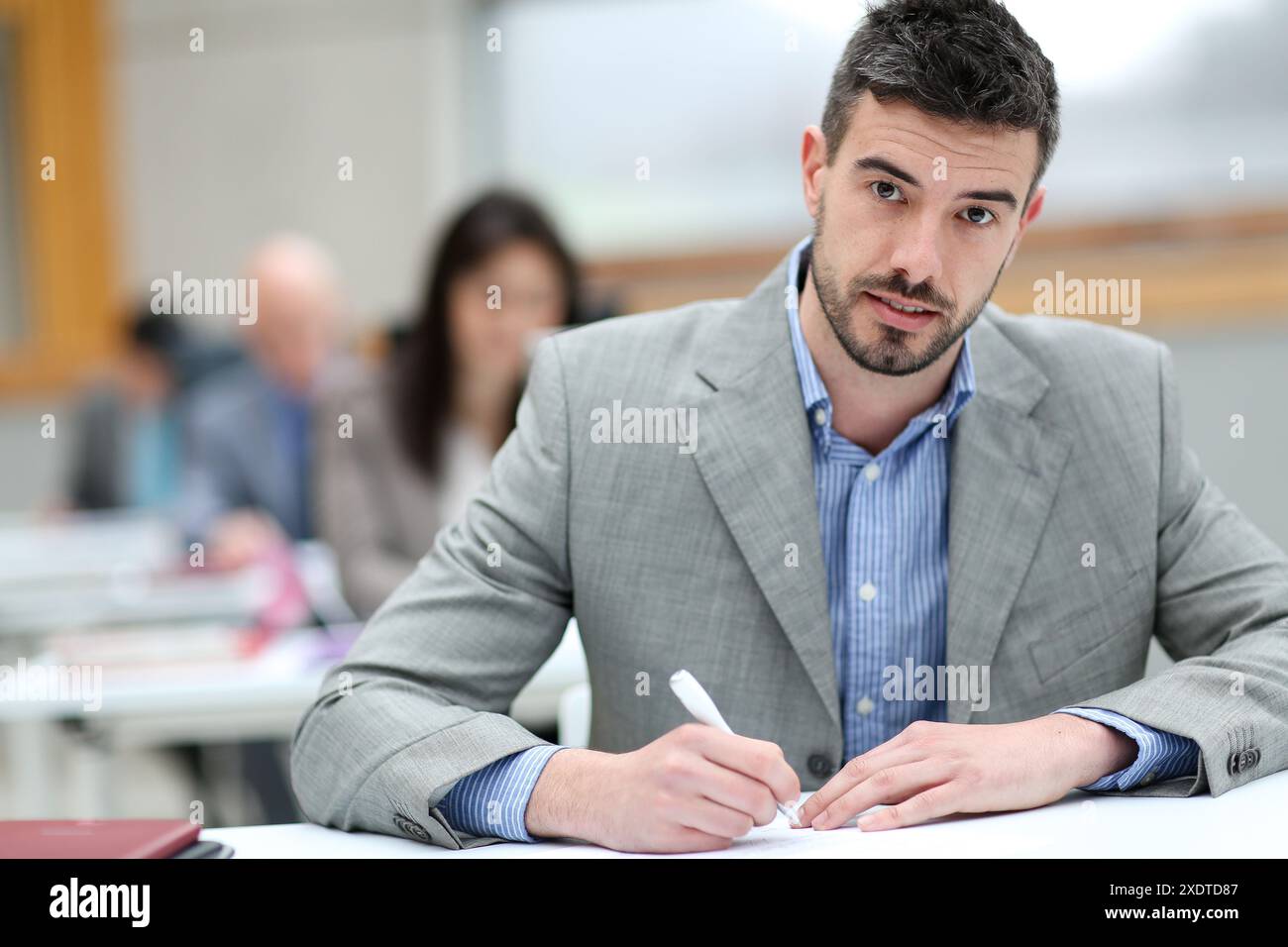 Businessman taking notes Stock Photo - Alamy