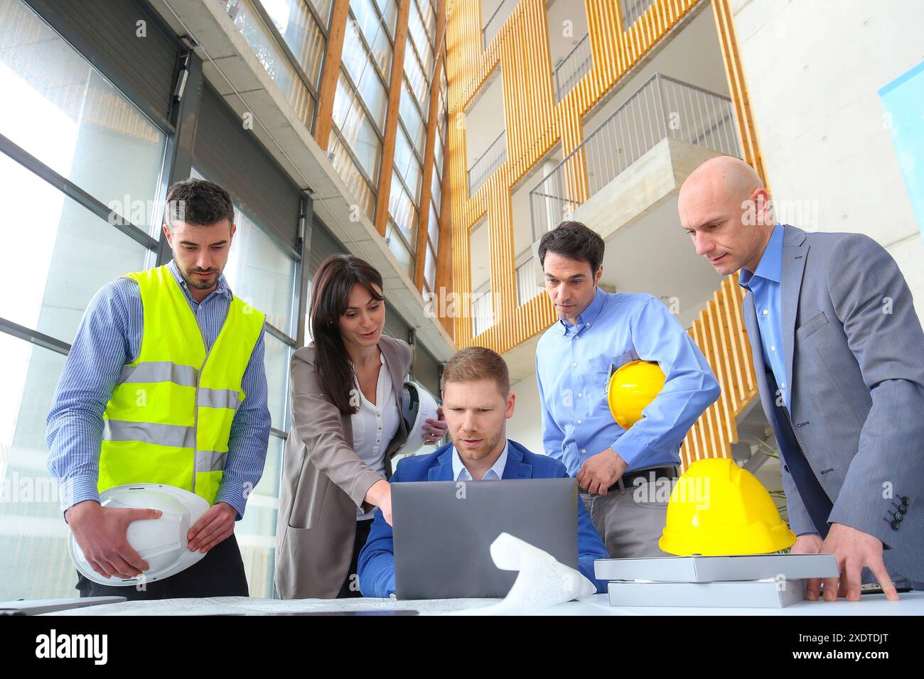 Engineers looking at map Stock Photo - Alamy