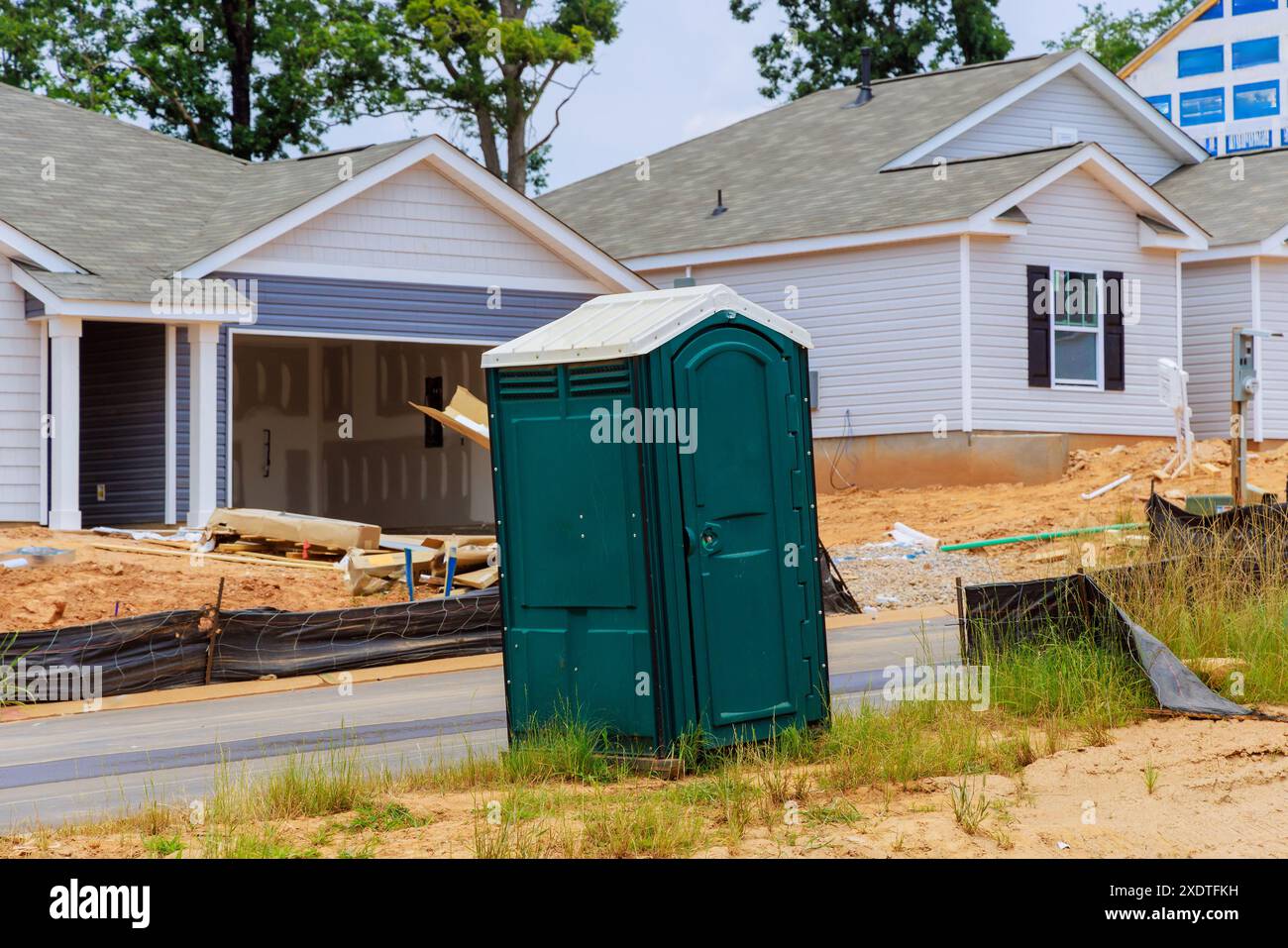 During construction of house, portable plastic bio toilet cabins stalls ...