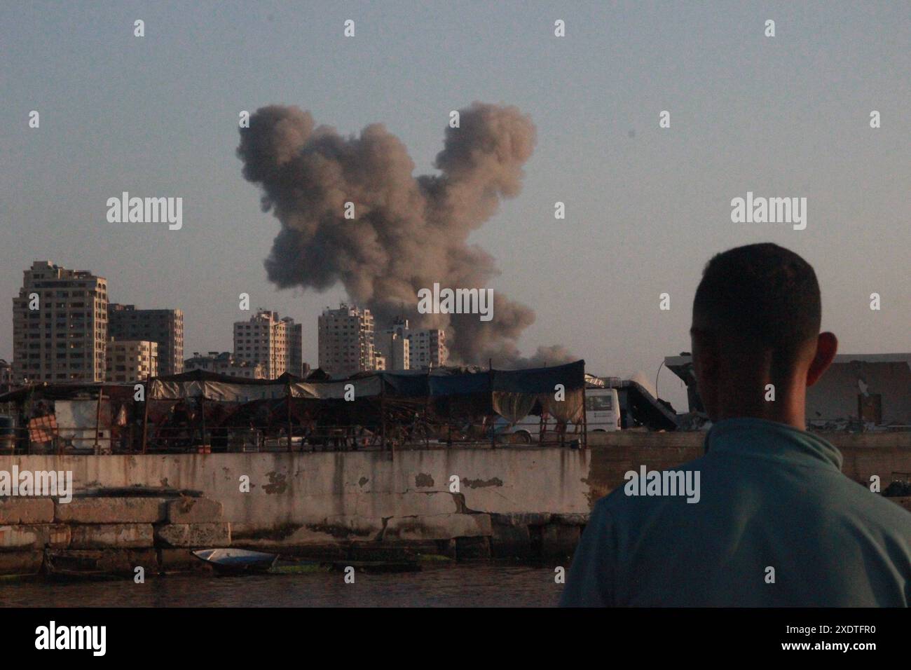 Black smoke billows following an Israeli air strike that targeted a ...