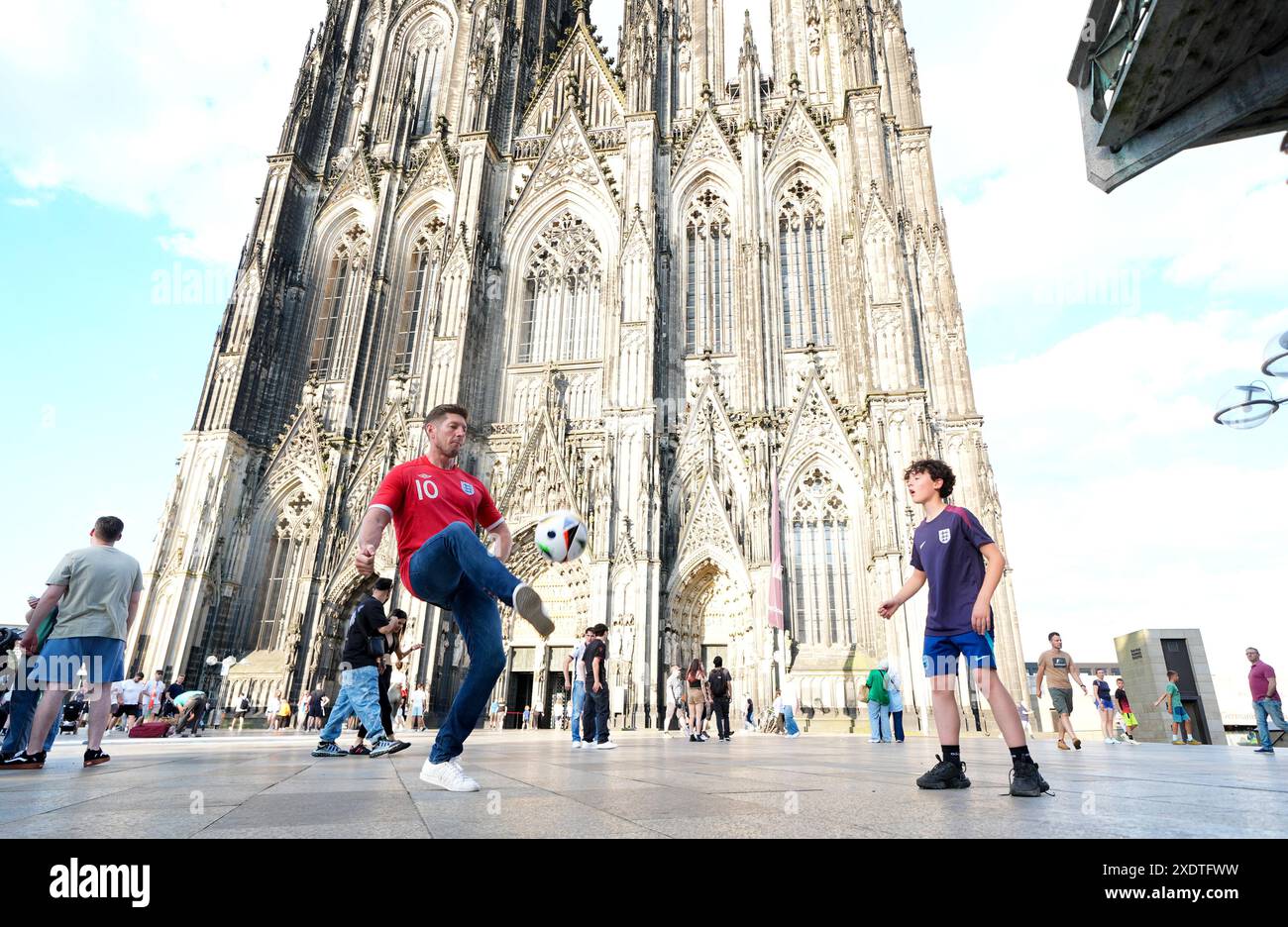 England fans play football in front of Cologne Cathedral. England play ...