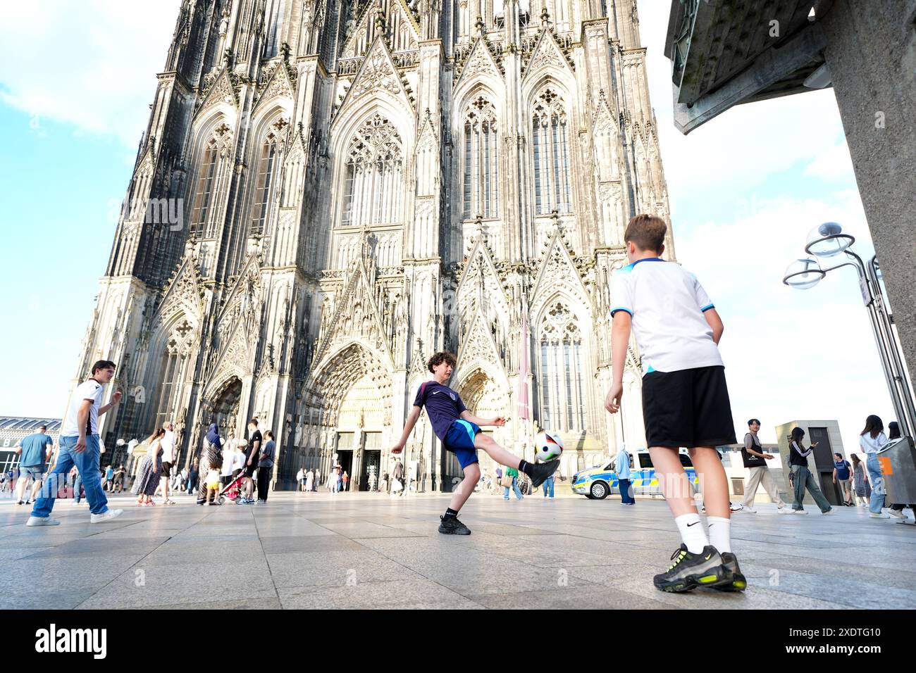 England fans play football in front of Cologne Cathedral. England play ...