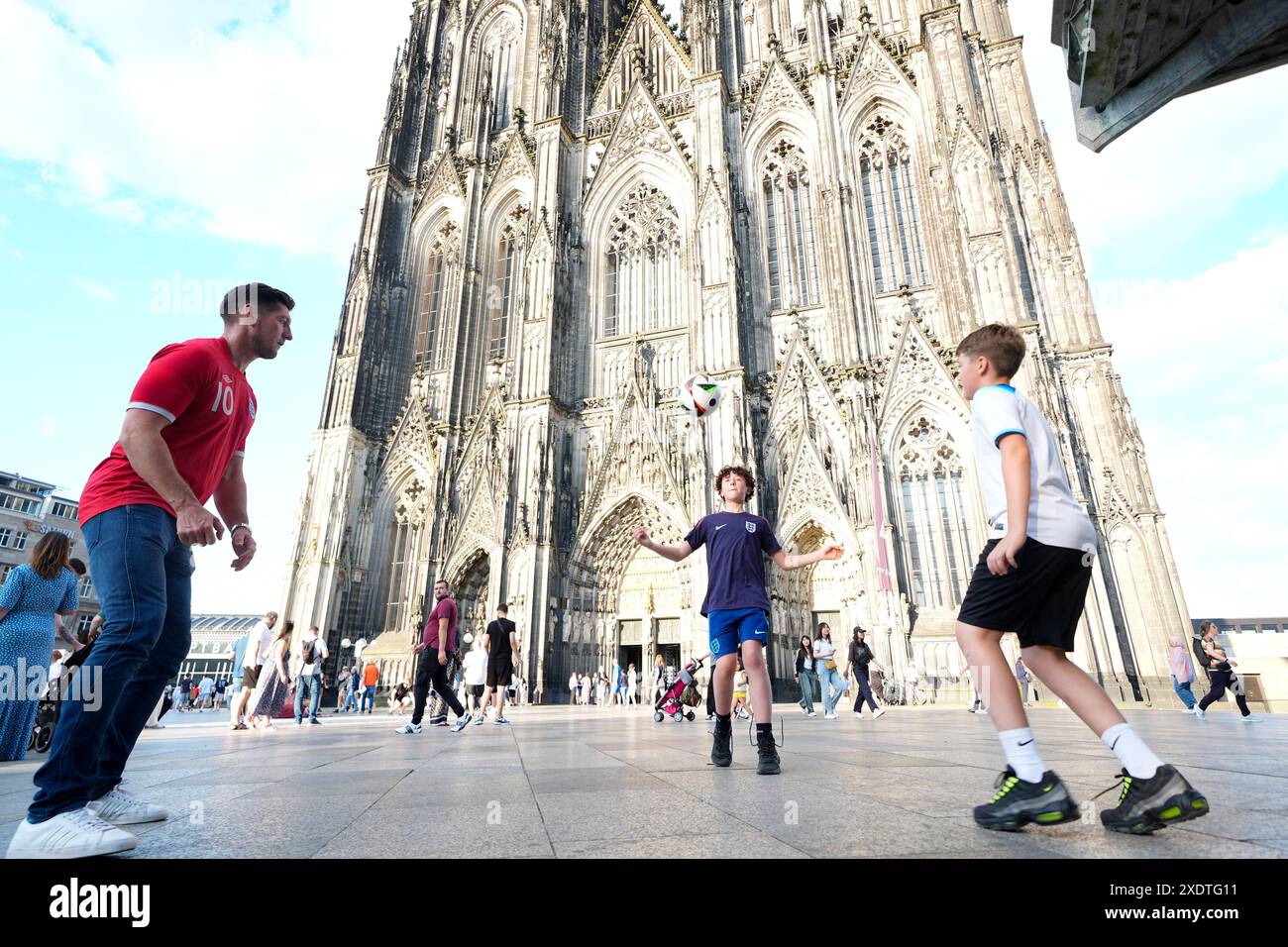 England fans play football in front of Cologne Cathedral. England play ...