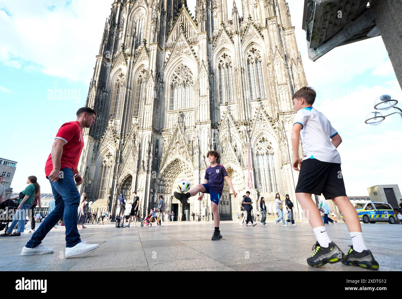 England fans play football in front of Cologne Cathedral. England play ...