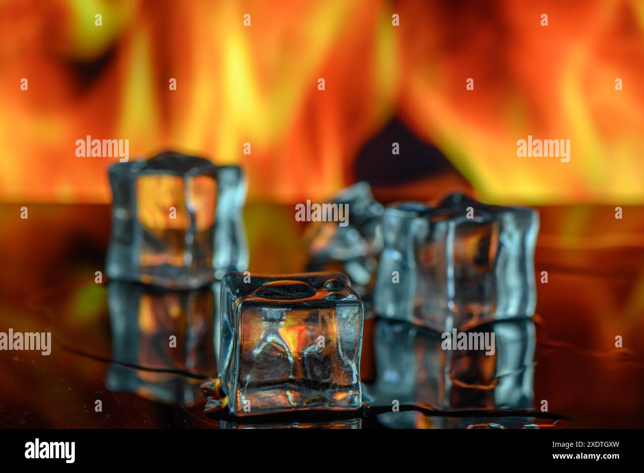Ice melting with flames on background. 6 Stock Photo - Alamy