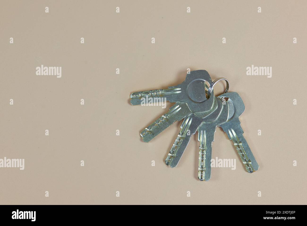 High security key on beige background Stock Photo - Alamy