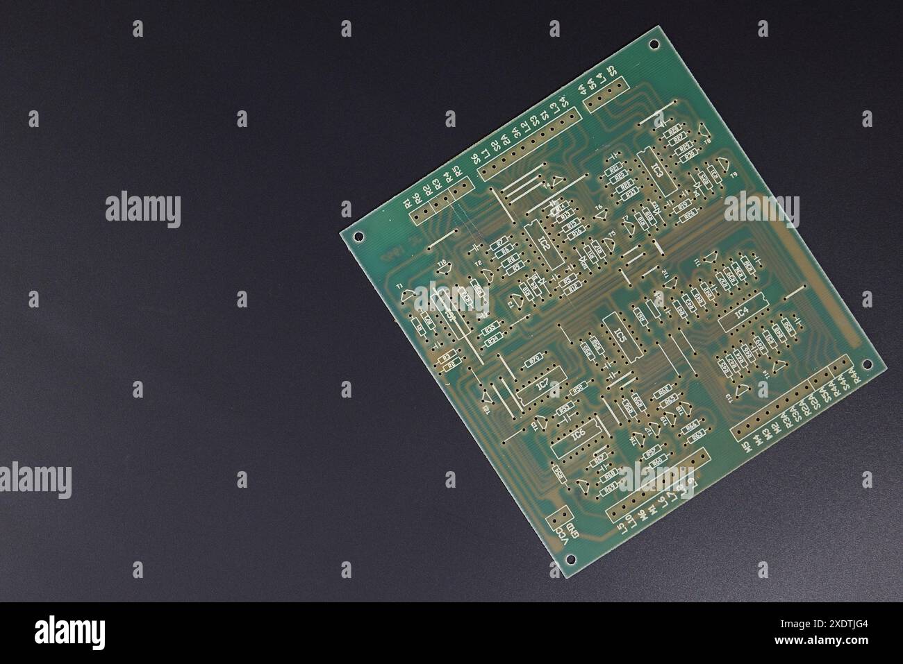 Green electronic circuit board with semiconductors on black background Stock Photo - Alamy