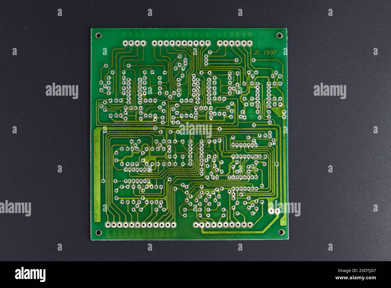 Green electronic circuit board with semiconductors on black background Stock Photo - Alamy