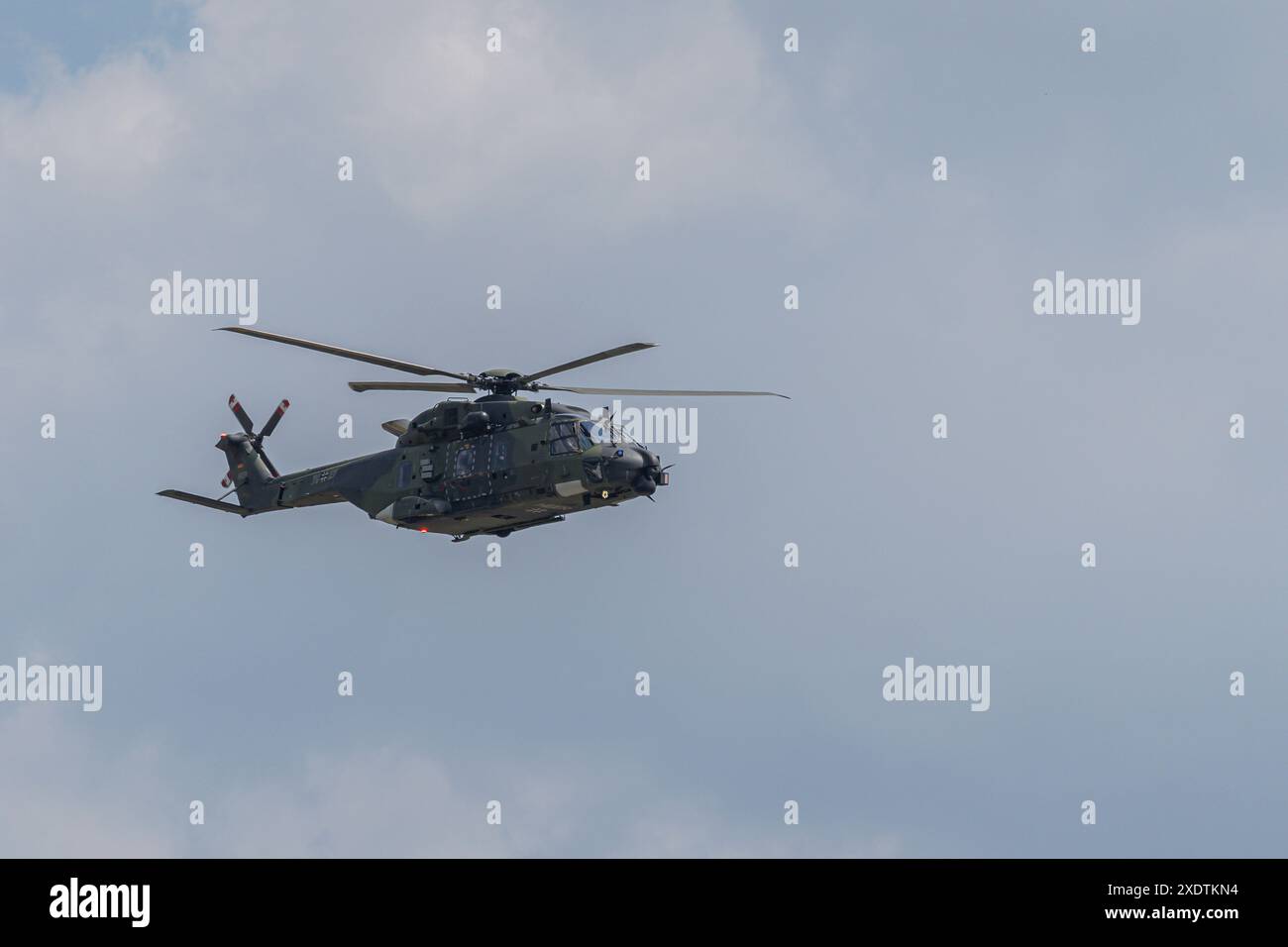 German military transport helicopter, NH 90 flies on airfield in Berlin ...