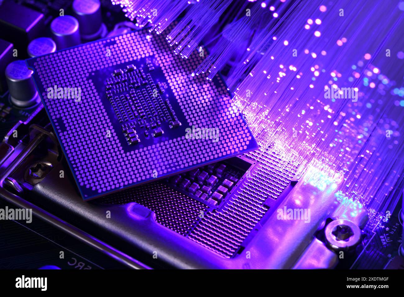Detail of CPU on socket of a PC motherboard illuminated by a fiber ...