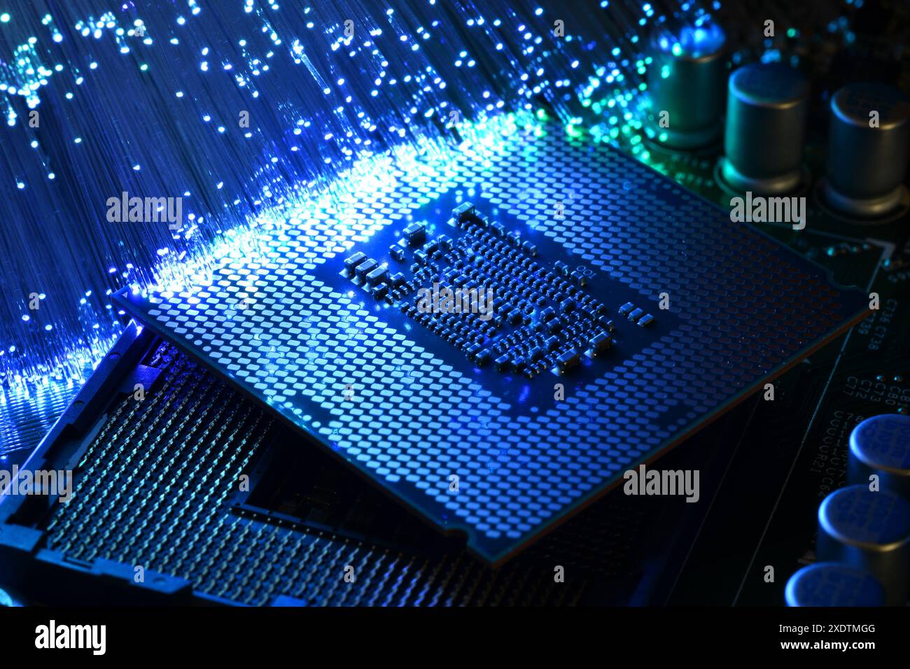 Detail of CPU on socket of a PC motherboard illuminated by a fiber ...