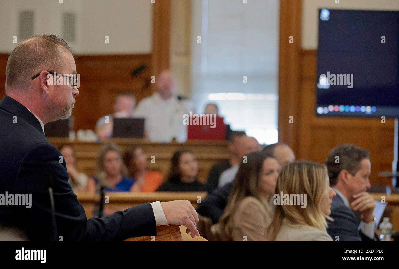 Adam Lally cross-examines Daniel Michael Wolfe (not shown), director of ...