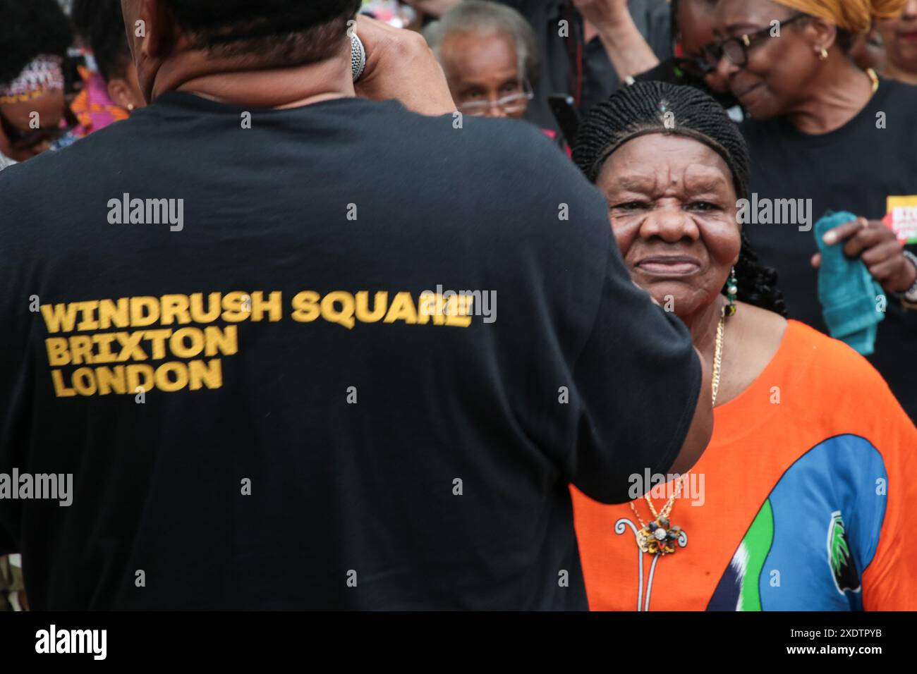 London UK 23 June 2024 People listen to speakers in Windrush Square as ...
