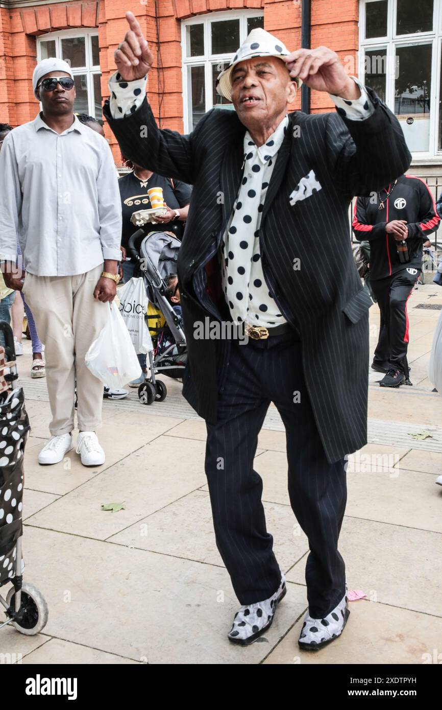 London UK 23 June 2024 A Man dances in Windrush Square as people mark ...