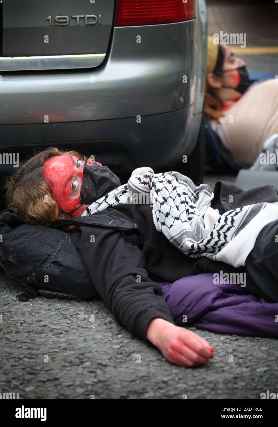 June 24, 2024, Bristol, England, UK: Two activists, their faces covered ...