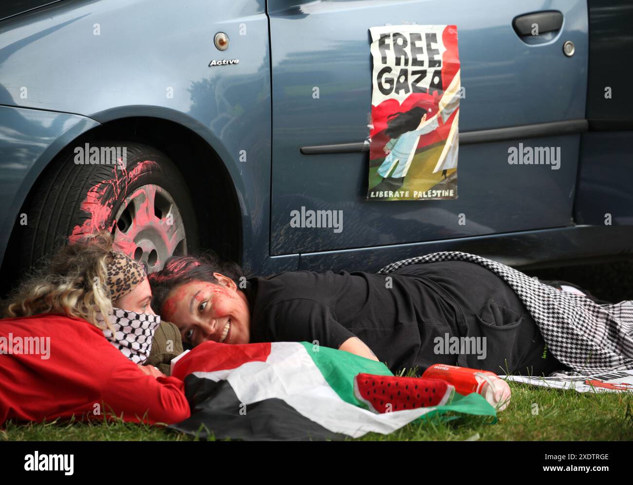 June 24, 2024, Bristol, England, UK: Two activists, their faces covered ...