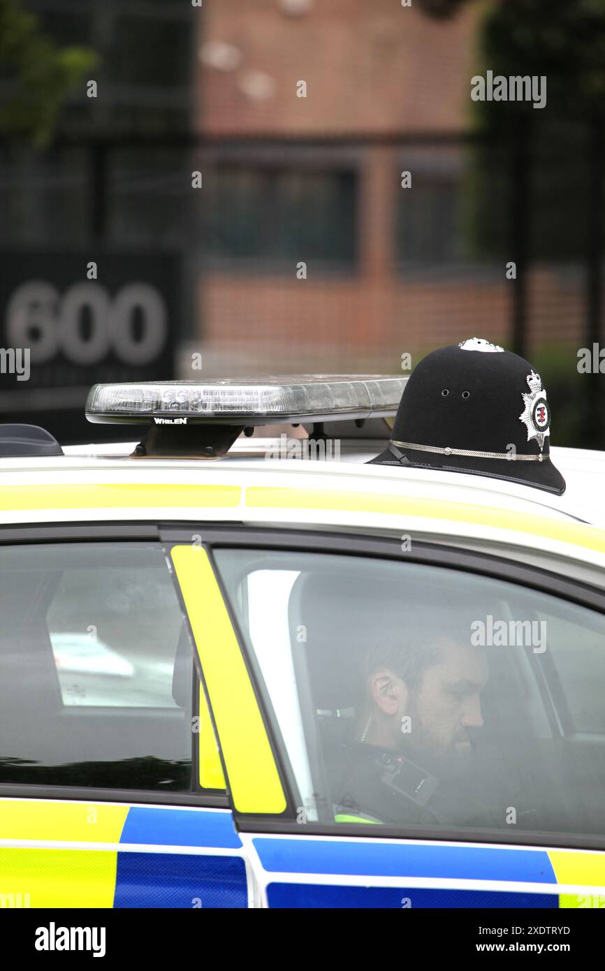 June 24, 2024, Bristol, England, UK: A police officer, his tall hat on ...
