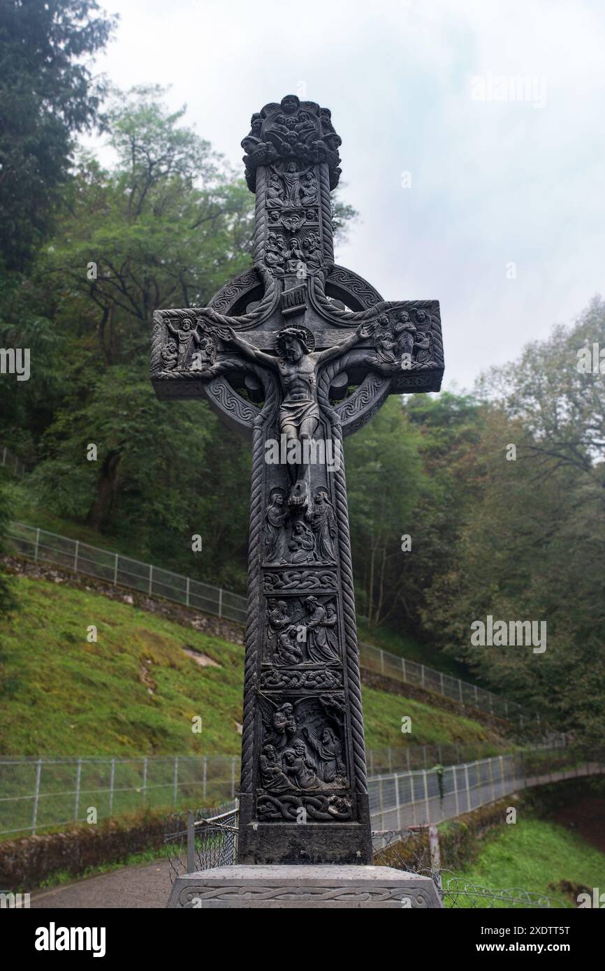 Carved Catholic cross with crucified Jesus Christ and carved religious ...