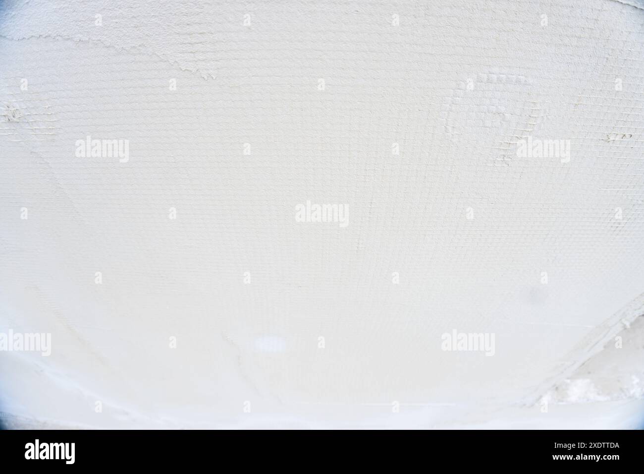 Builder installing rigid styrofoam insulation board for energy saving ...