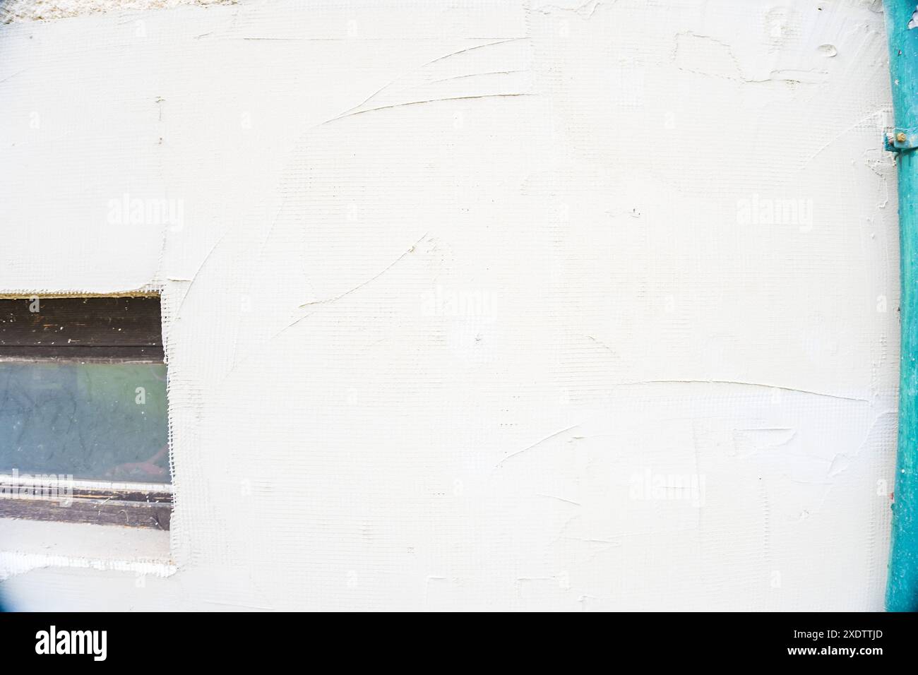 Builder installing rigid styrofoam insulation board for energy saving ...